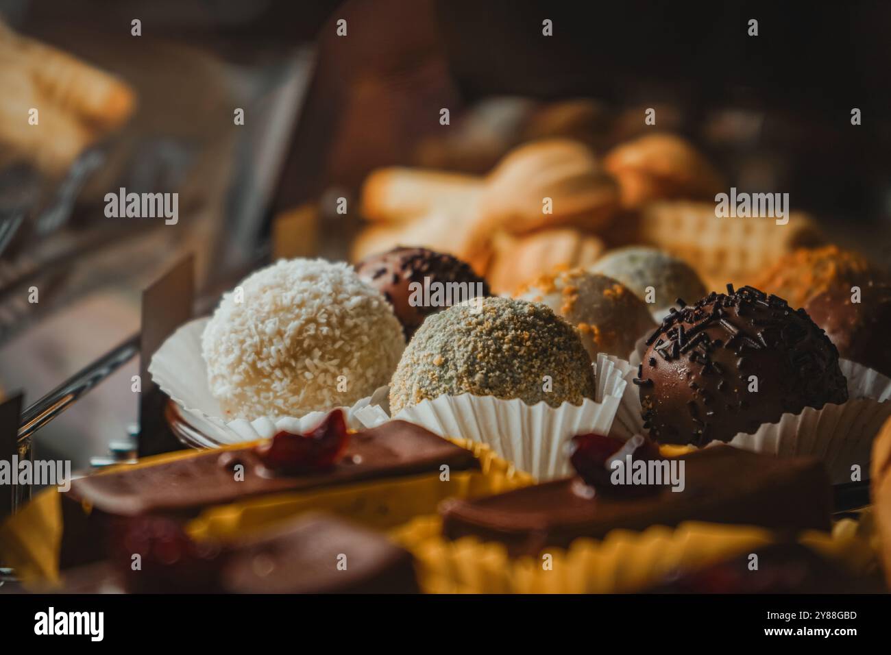Delightful cafe sells various kinds of cakes in glass display cases ...