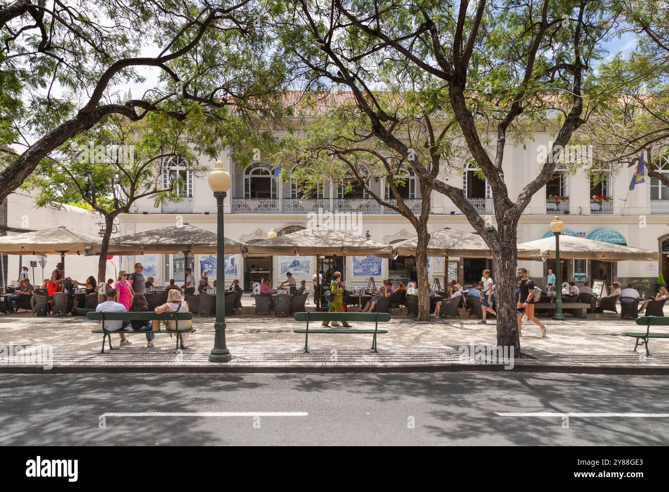 People enjoy the terrace in front of the Ritz Madeira; one of Funchal's ...