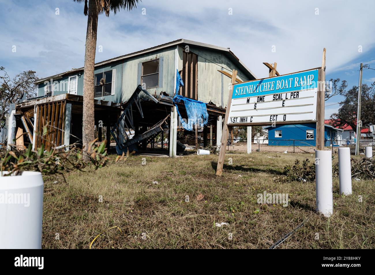 Wrack from the storm surge can be seen throughout the small town of ...