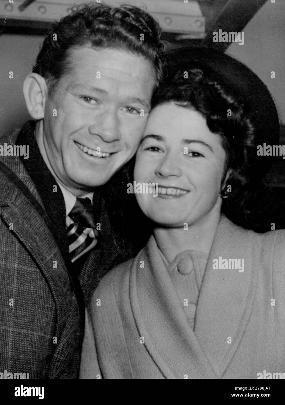 Ken Bailey and his wife, photographed on their return to Sydney today ...