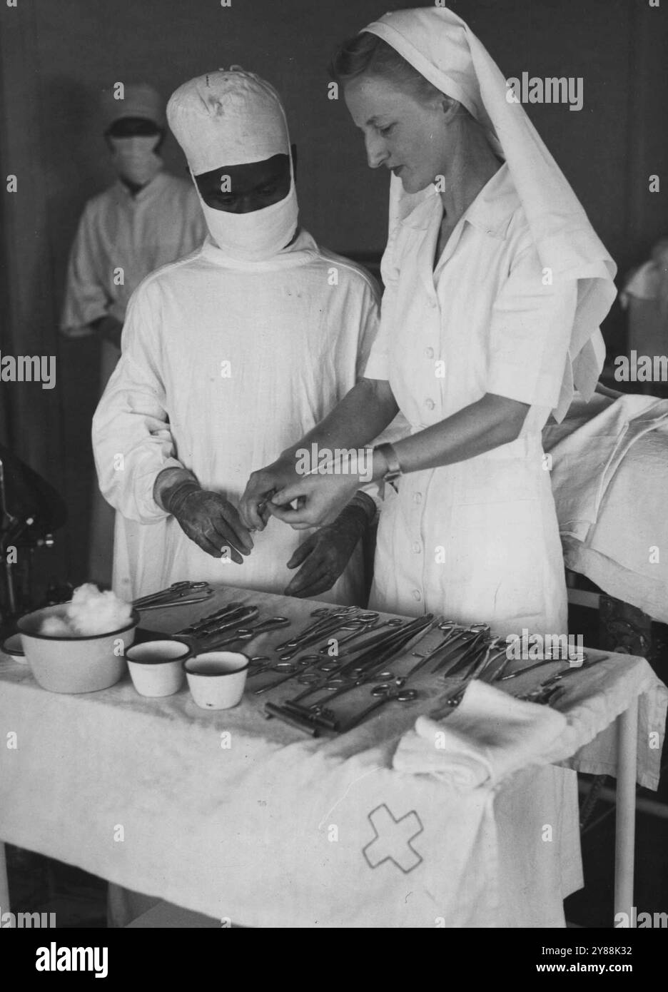 Sister at Port Moresby Native Hospital instructs Papuan boy in ...