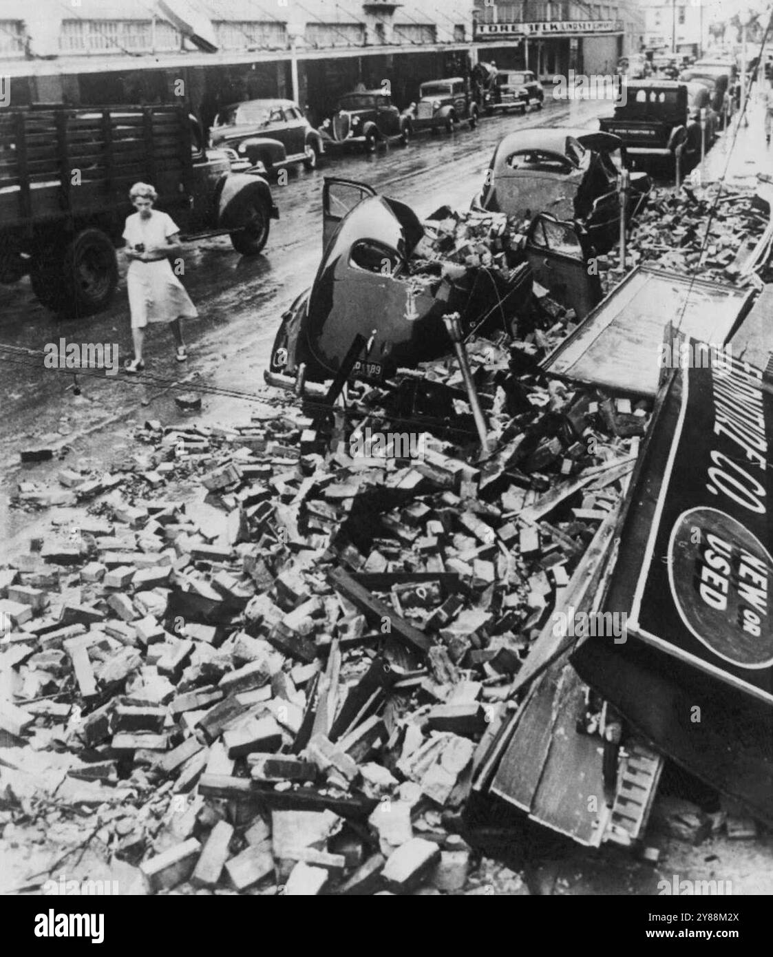 Downtown Hurricane Damage - These two cars were crushed when the front ...