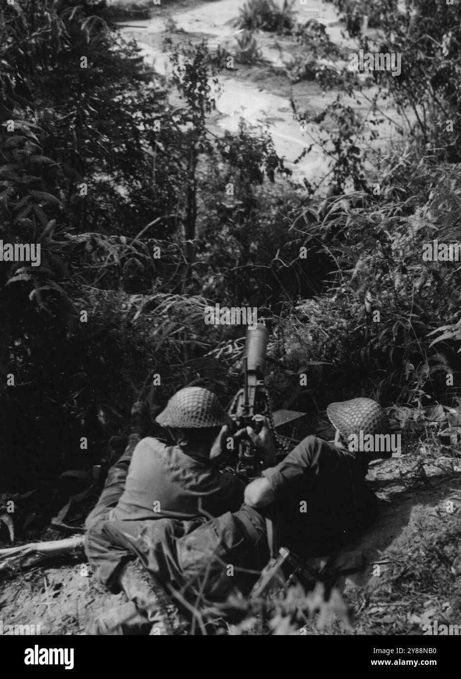 Machine-gun duel on Tarakan. Australian Vickers machine-gunners engage ...