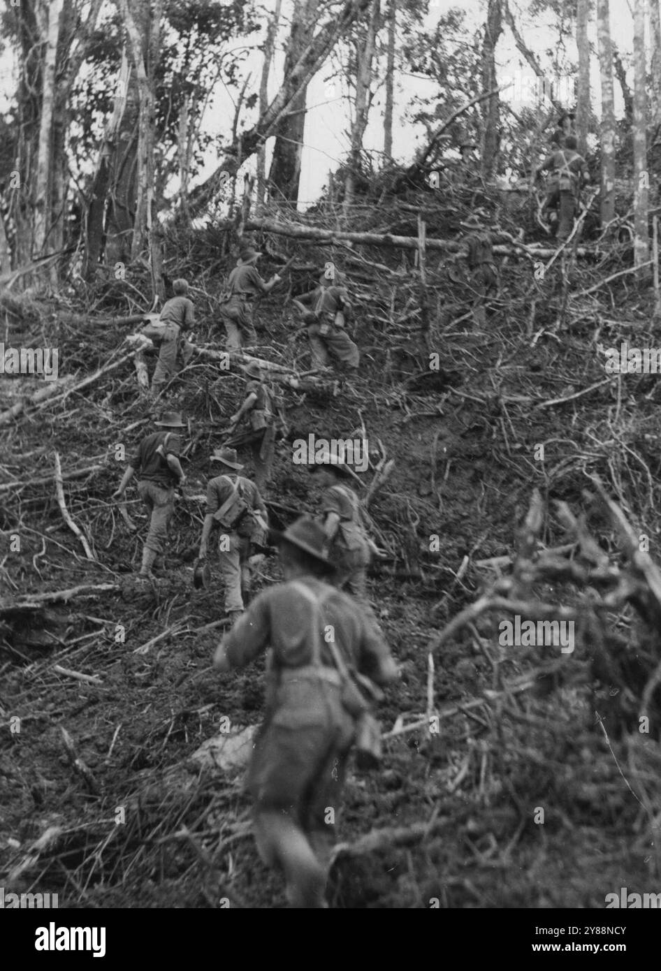 Sixth Australian Division infantrymen mounting a steep feature for ...