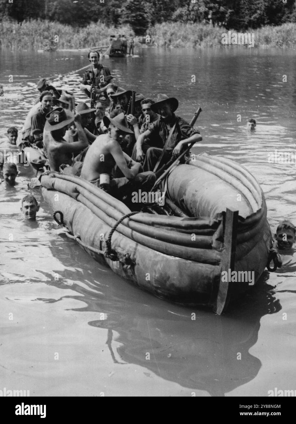 Australian troops utilise a ***** assault boat captured from the ...