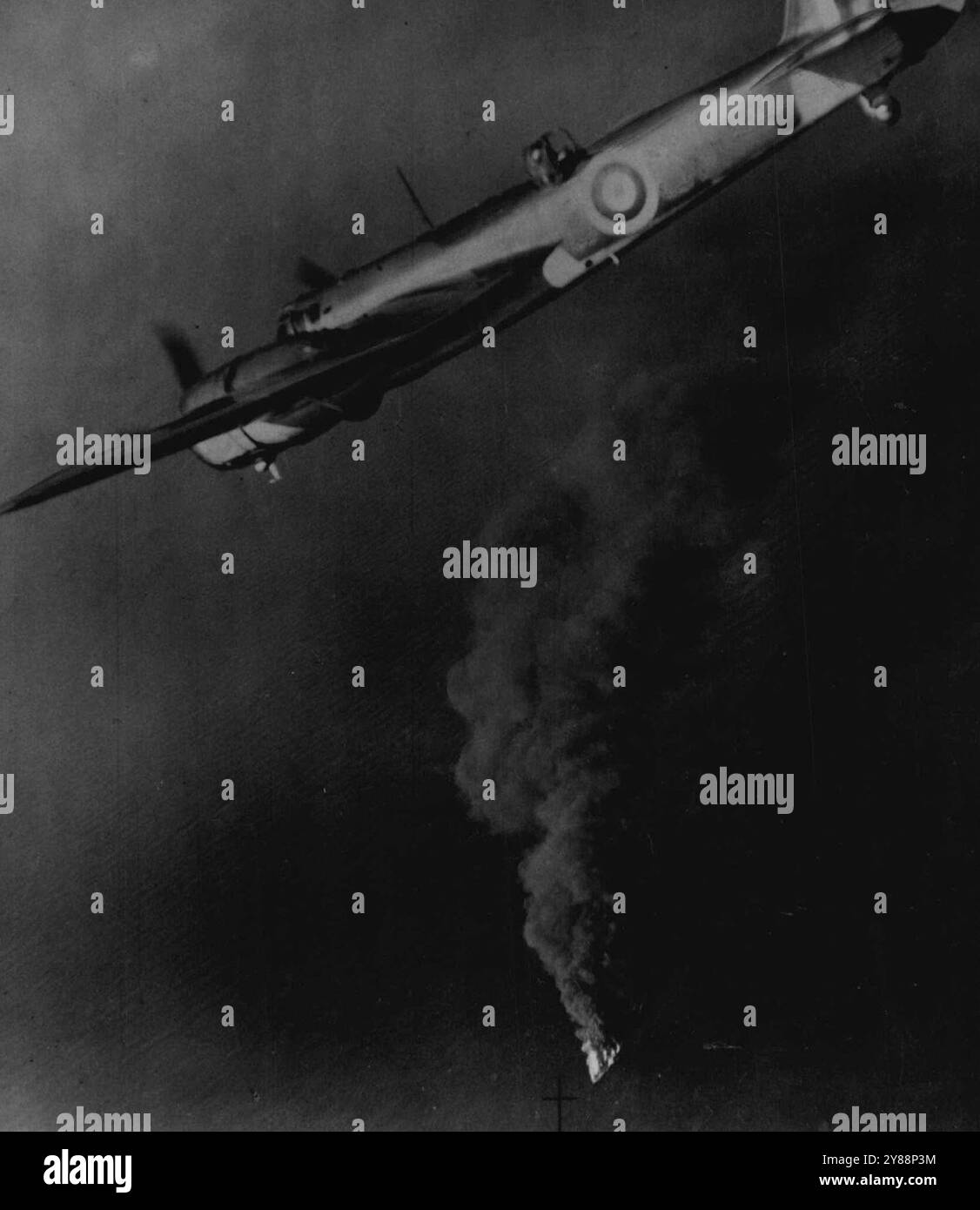 An R.A.F. Bomber watches the end of an enemy tanker as ablaze from stem ...
