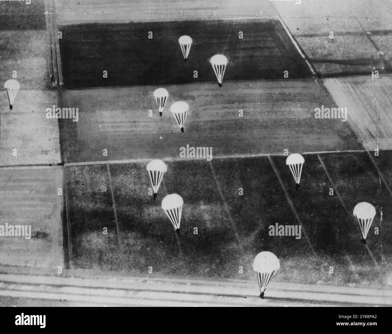 Ten army men jump from same plane with parachutes, breaking previous ...