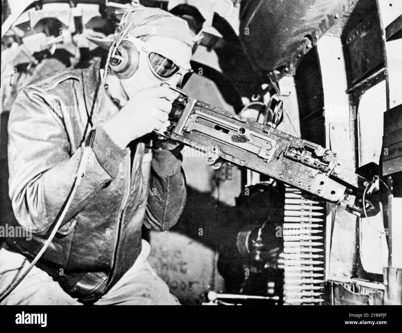 U.S. Bombers Blast Japanese Base In New Guinea -- A gunner aboard a B ...