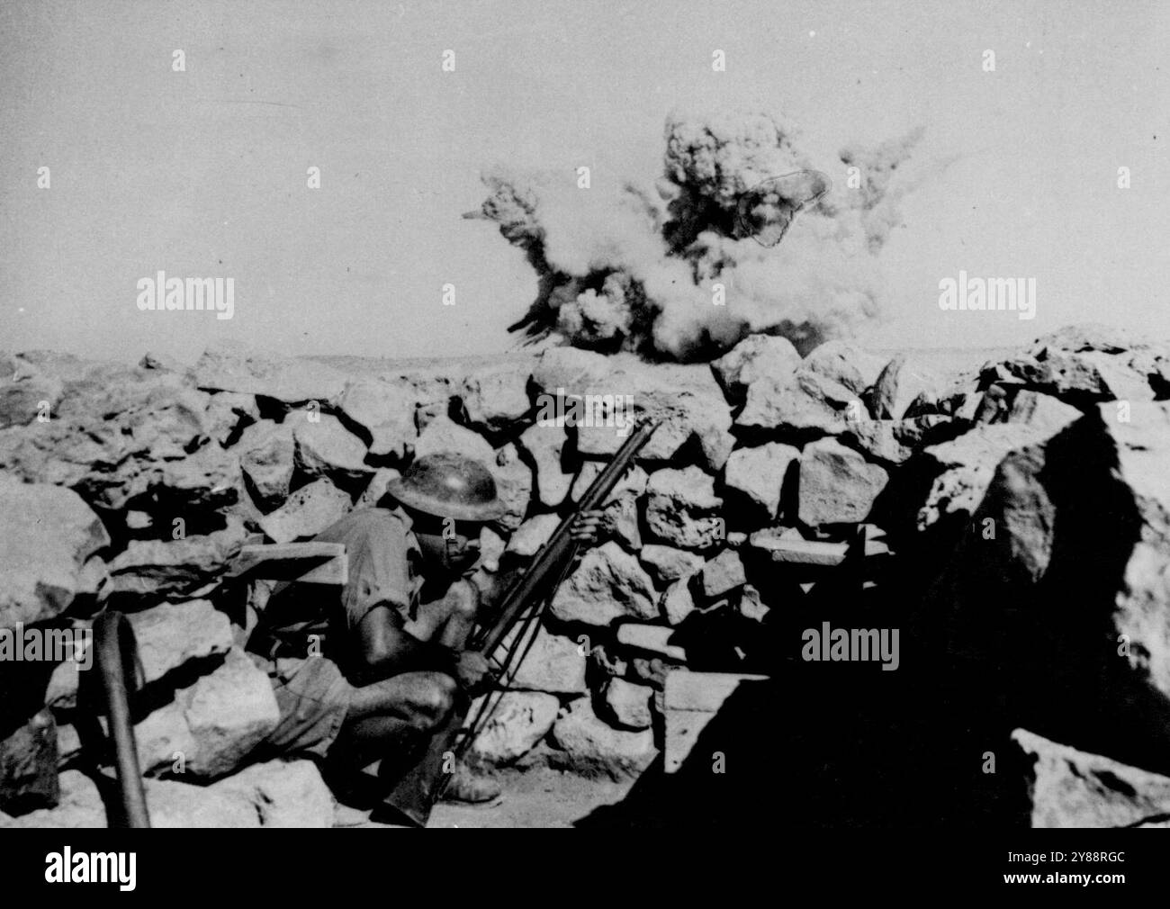 Making Tank Pits -- Enemy bombs left behind by Italians in Tobruk are ...