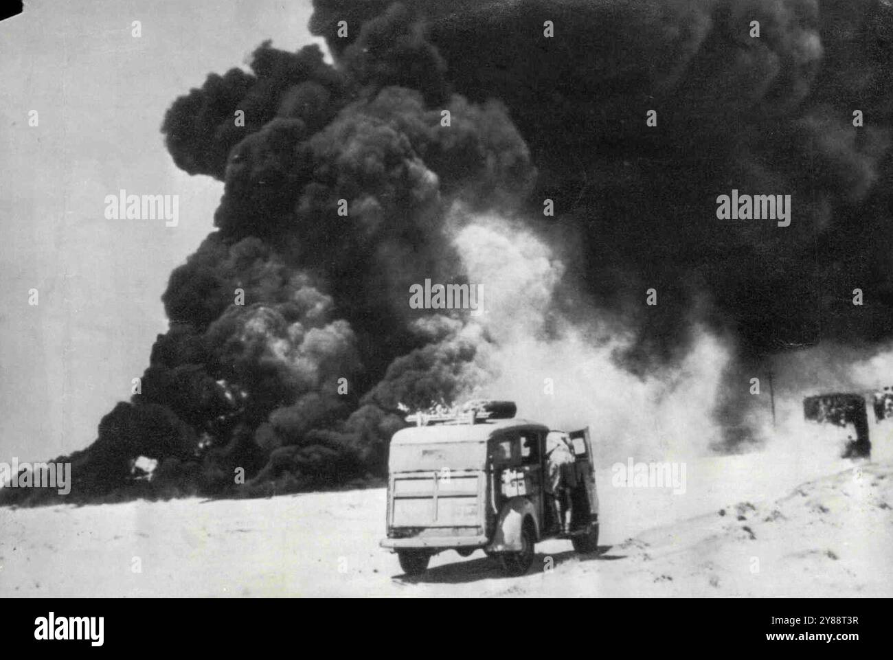 Fire in the Western Desert ,, A huge column of black smoke fours out of ...