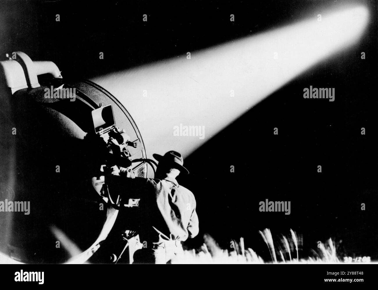 The Army's Eyes -- An Army searchlight scans the skies for imaginary ...