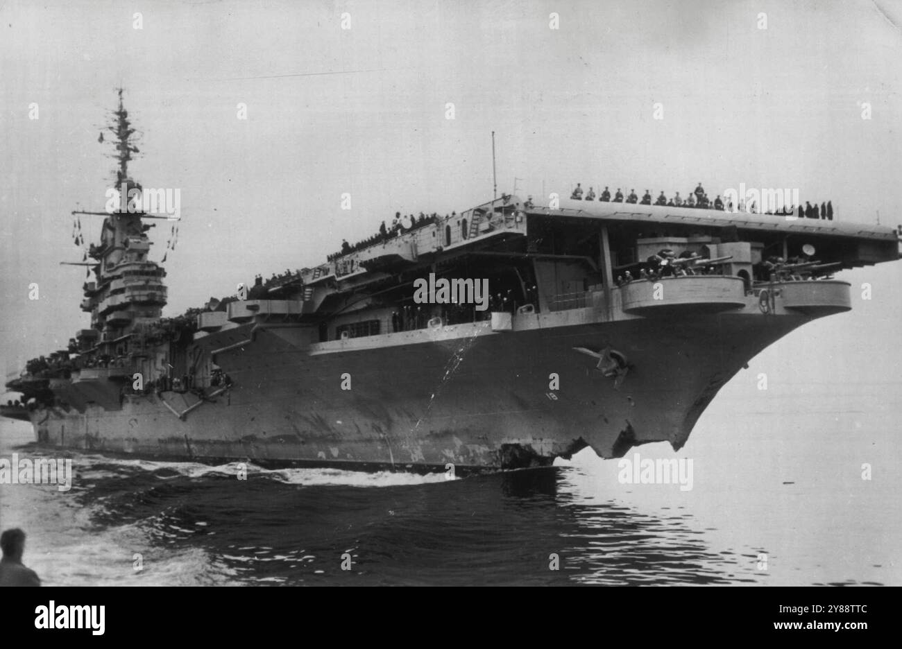 Damaged Wasp Arrives In New York Harbor - The battered bow of the ...