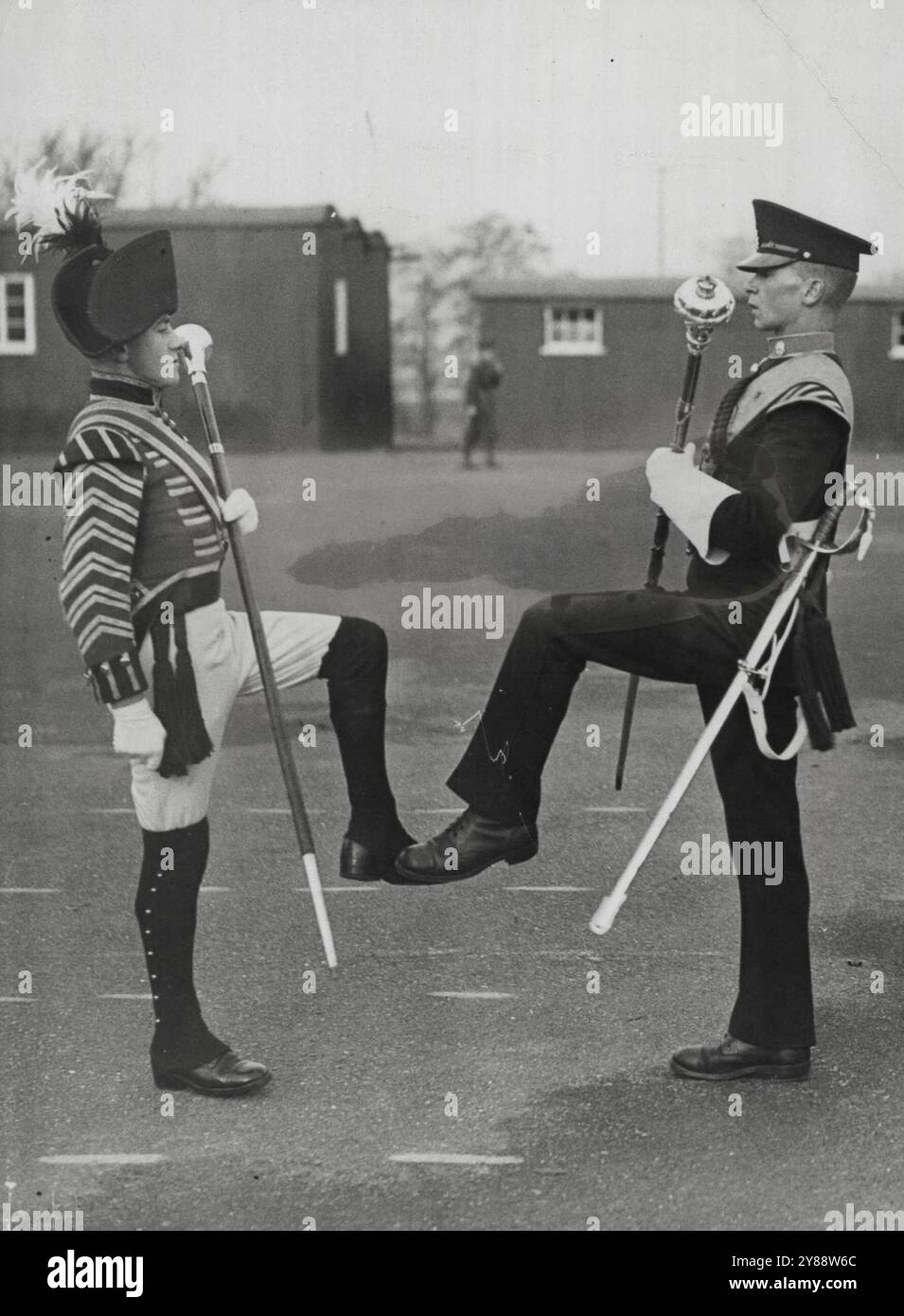 Rehearsing Big Military Display -- Regimental Drum Major Pope handing ...