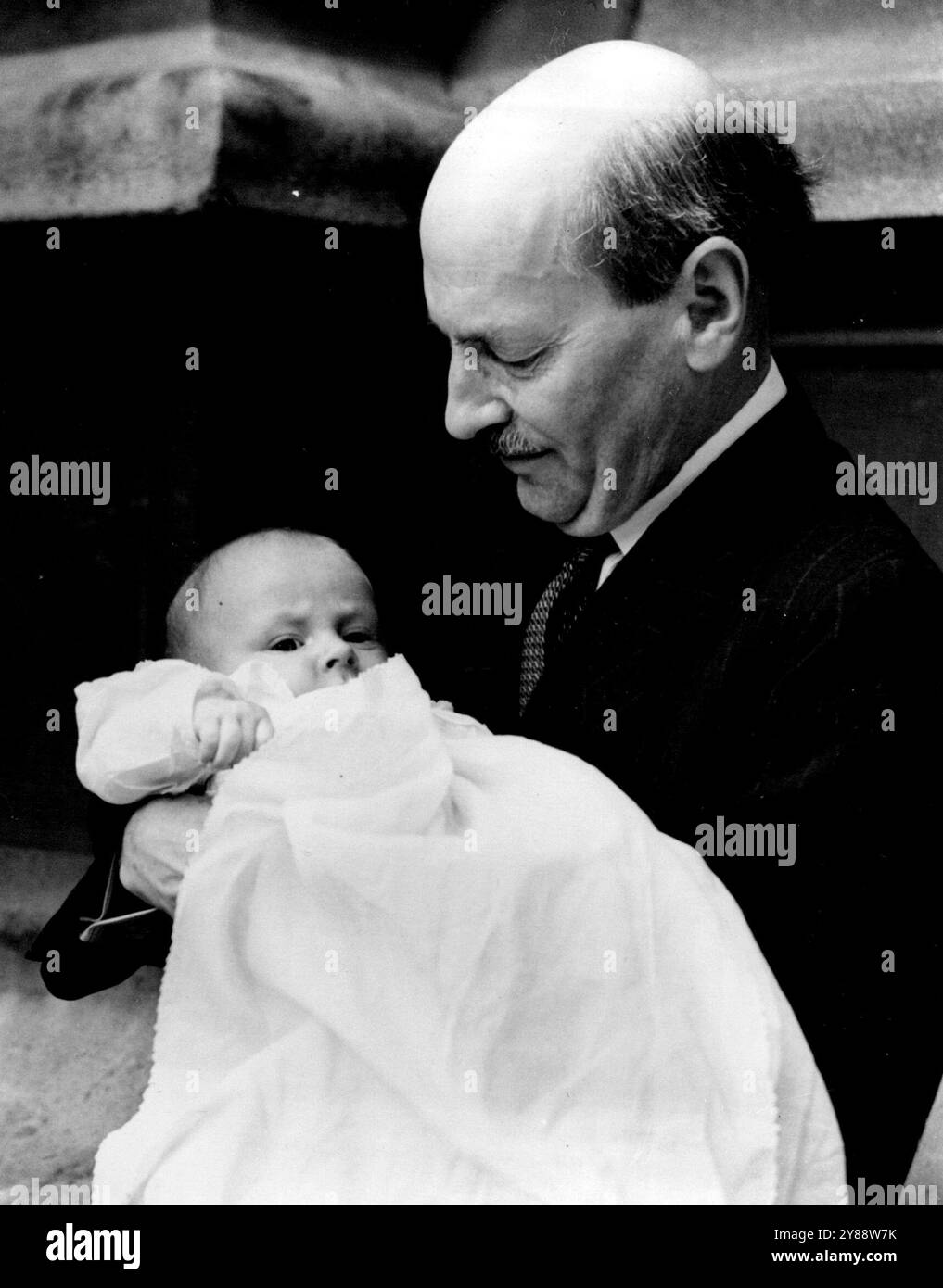 Mr. Attlee, bestows a look of affection on his god-son after the ...
