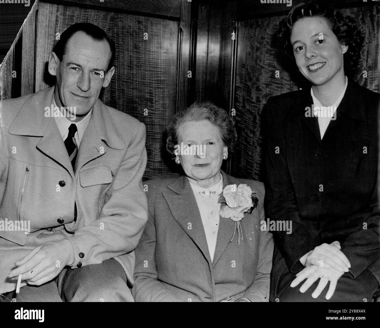 Left to right: Mr. R. M. Ansett, his mother Mrs. Ansett and his wife ...