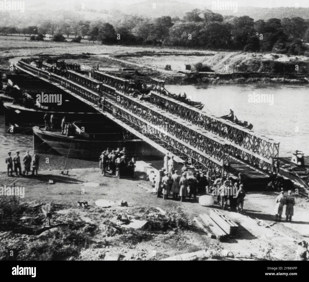 British Bridge Under Construction -- A Bailey Bridge here being ...