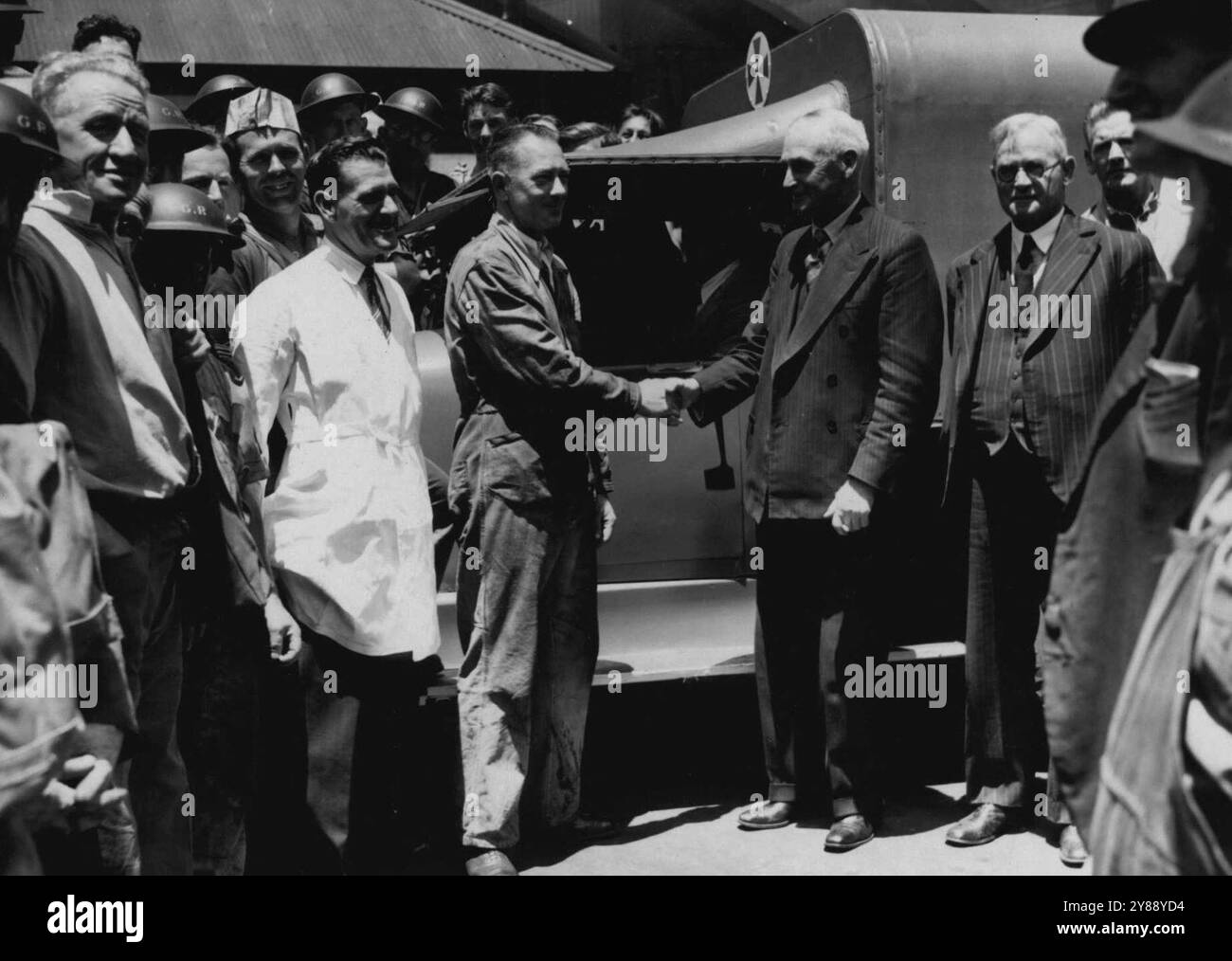 Deputy Chief Warden Douglas of Eveleigh Workshops ***** over ambulance ...