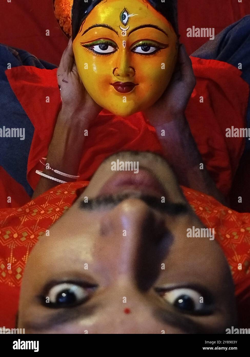 October 4, 2024, Dhaka, Bangladesh: An artist poses for a photo with a ...