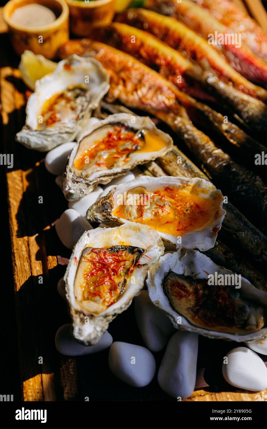 Grilled oysters with spicy sauce, seafood delicacy perfect for fine ...