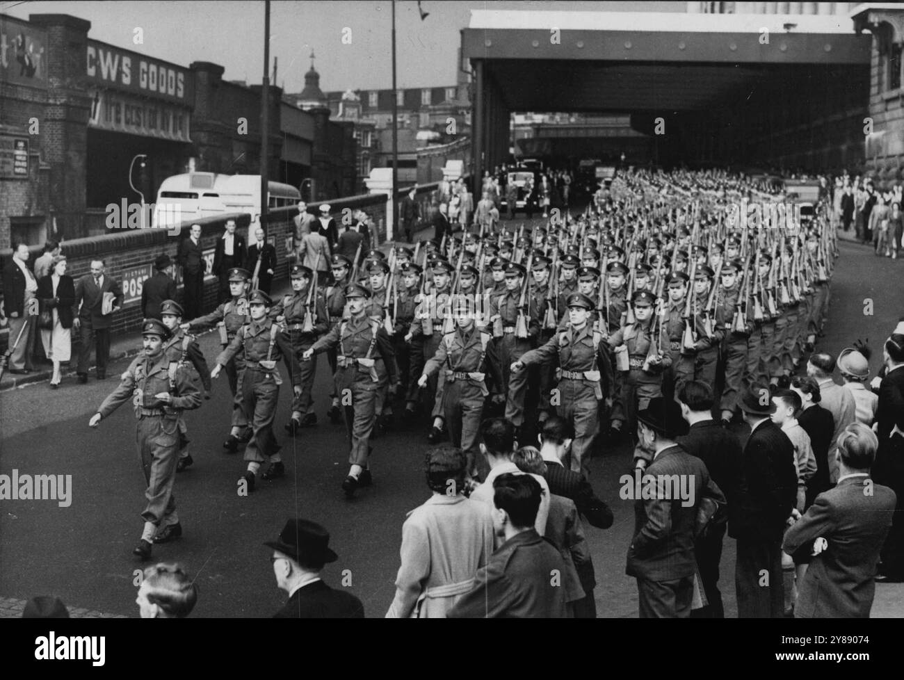 Guards Home From Malaya -- People line the pavements to watch the 3rd ...