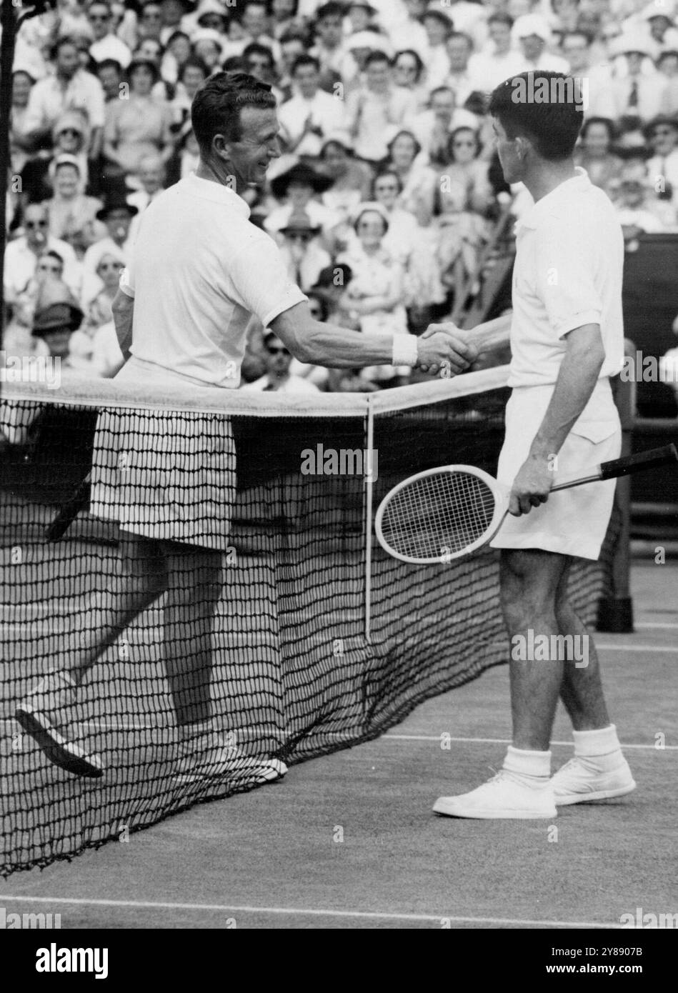 Rosewall Wins After Struggle Rosewall (right) and Arkinstall shakes ...