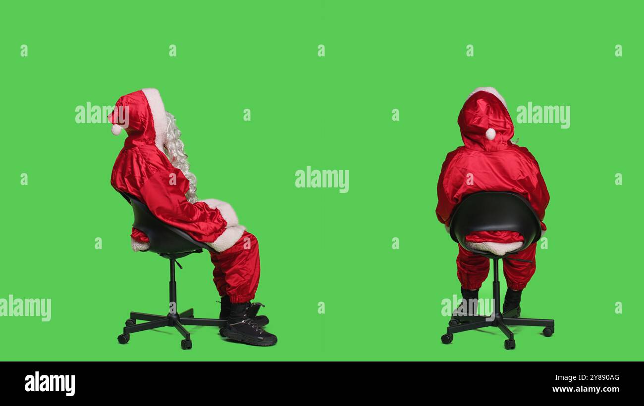 Father christmas cosplay sit on chair, looking around studio and ...
