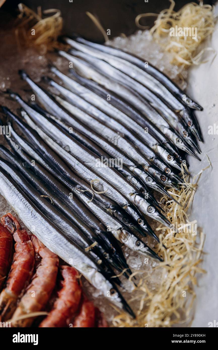 Fresh fish lined up on ice display at seafood market. Perfect for food ...