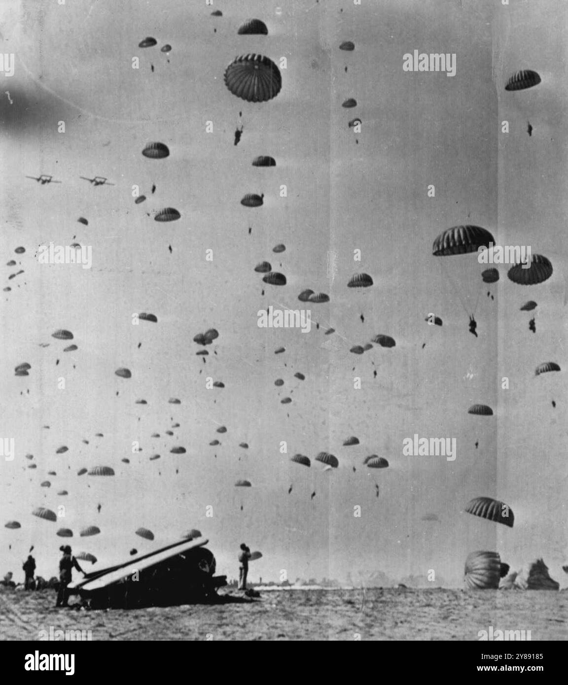 D-Day Drop - Troop of the 11th Airborne Division hit the silk over a ...