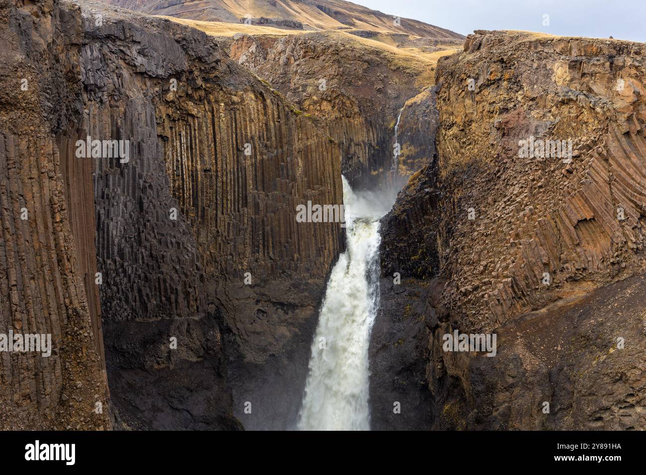Litlanesfoss (Studlabergsfoss) waterfall in Hengifossa in Fljotsdalur, Eastern Iceland with ...