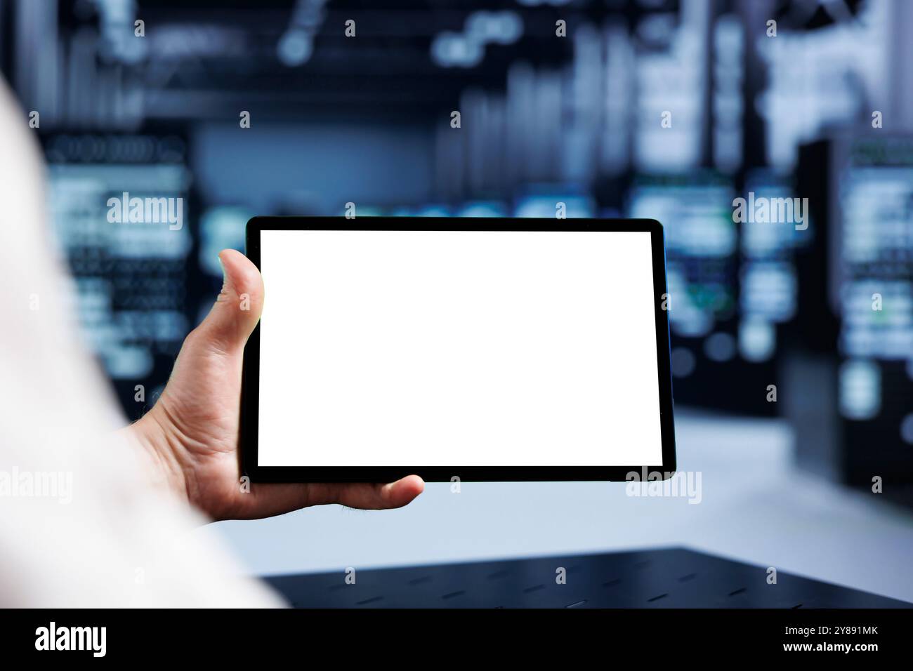 Adept IT developer using mock up tablet to check operational server rows, close up. Racks in ...