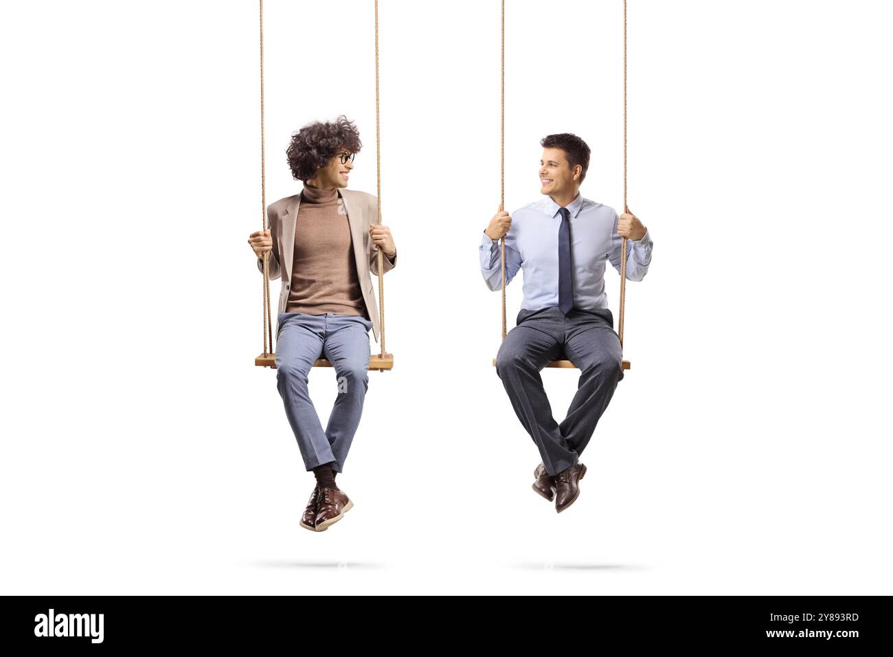 Men having fun and sitting on swings isolated on white background Stock ...