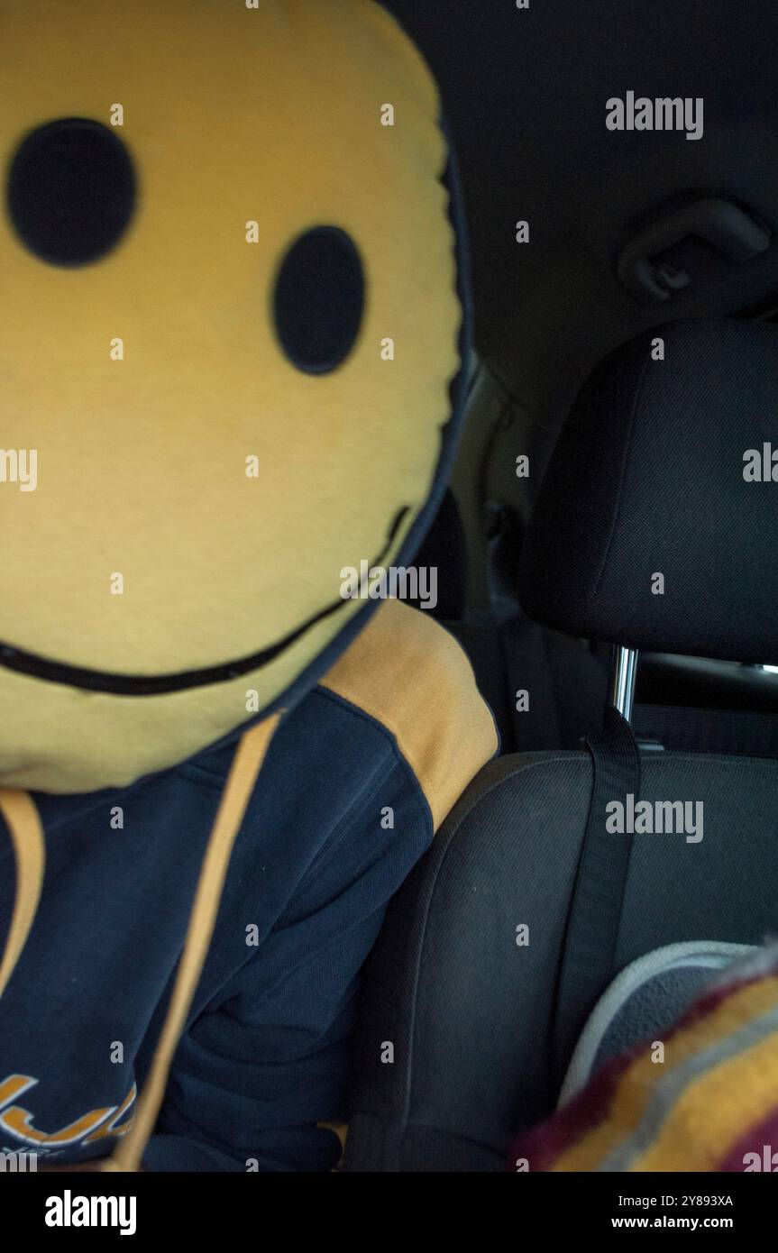 Whimsical Encounter in a Car with a Smiley Face Character Stock Photo ...