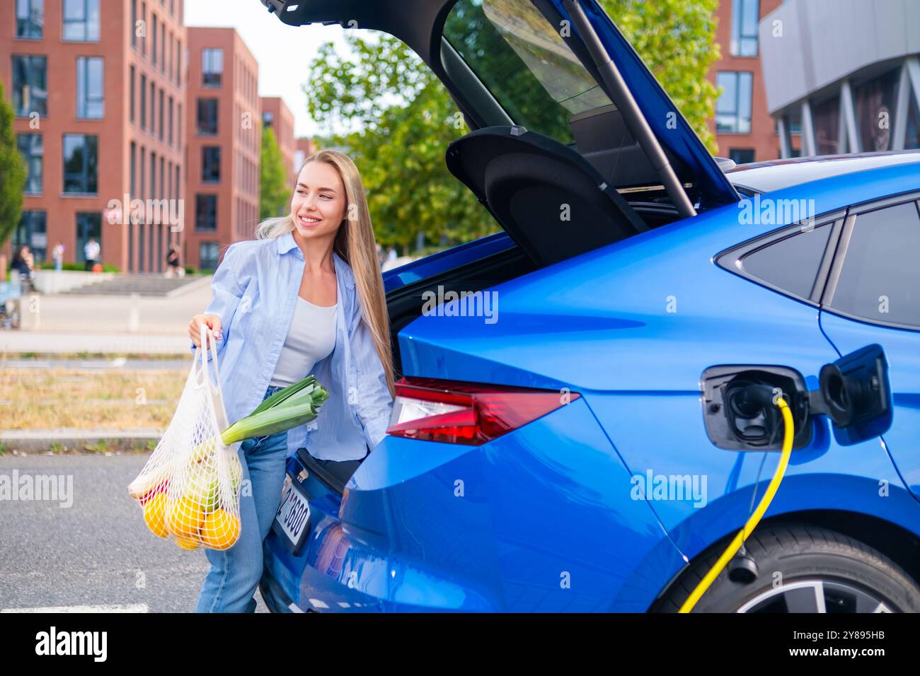 Loading groceries electric car hi-res stock photography and images - Alamy