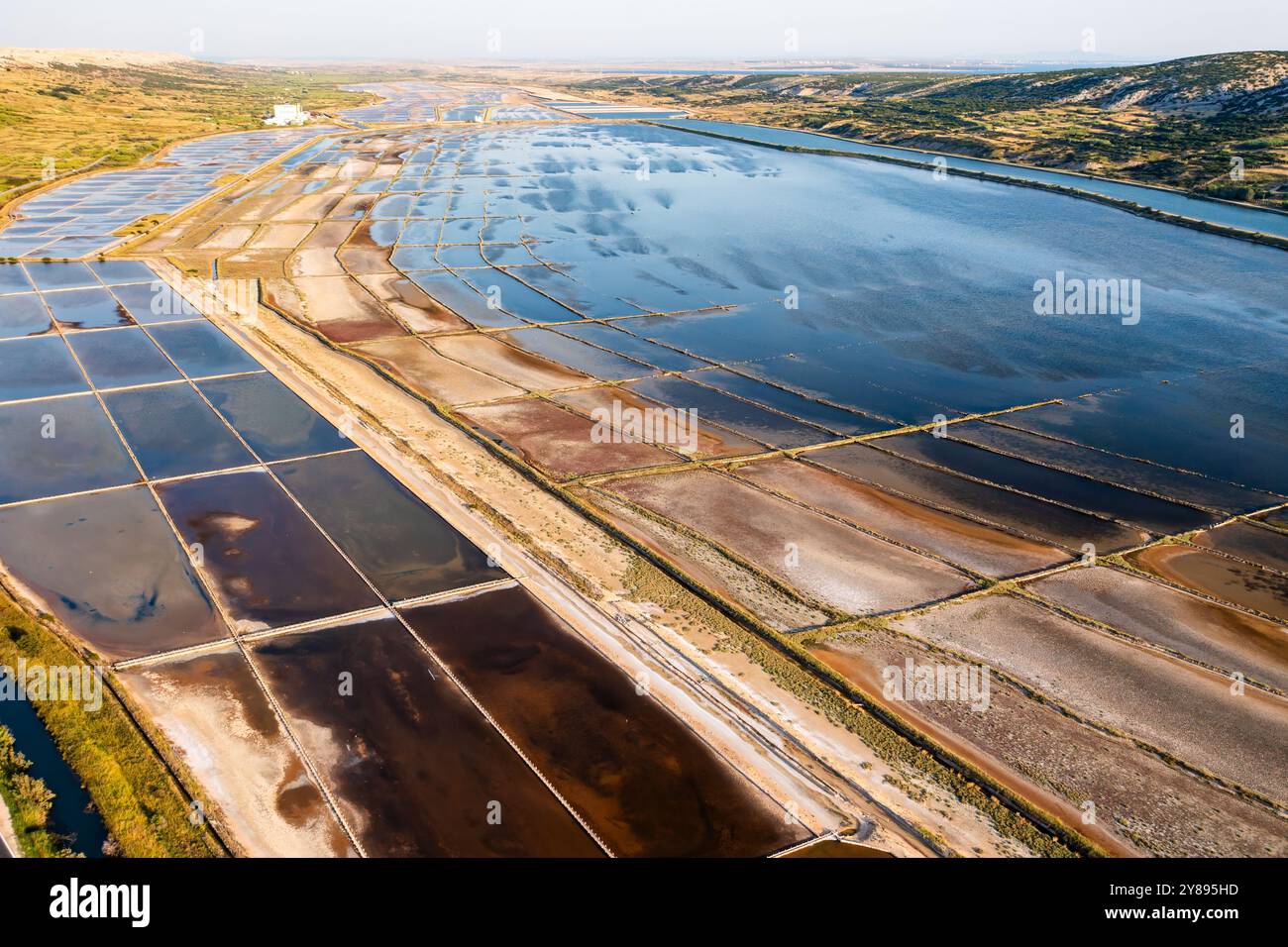 Vast salt pans capture seawater, facilitating the salt production ...