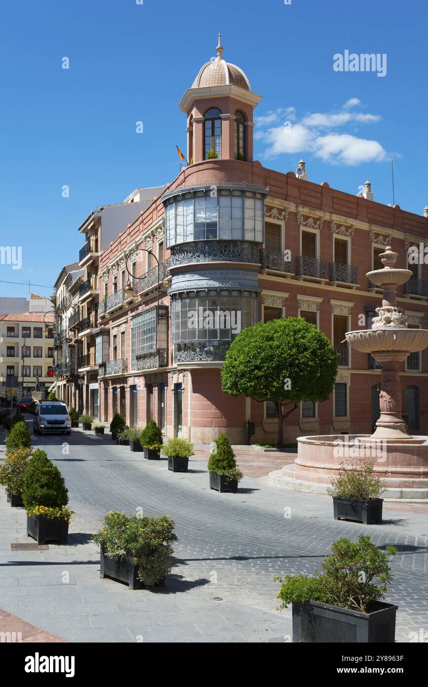 Historic building with bay window on an urban street with fountain and ...