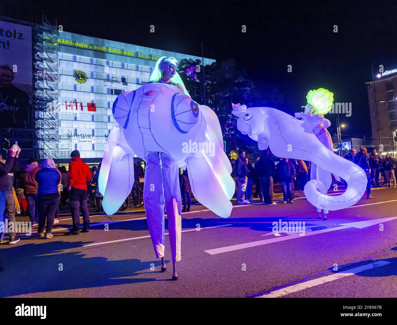 Walking act, underwater, stilt artists float gracefully across the ...