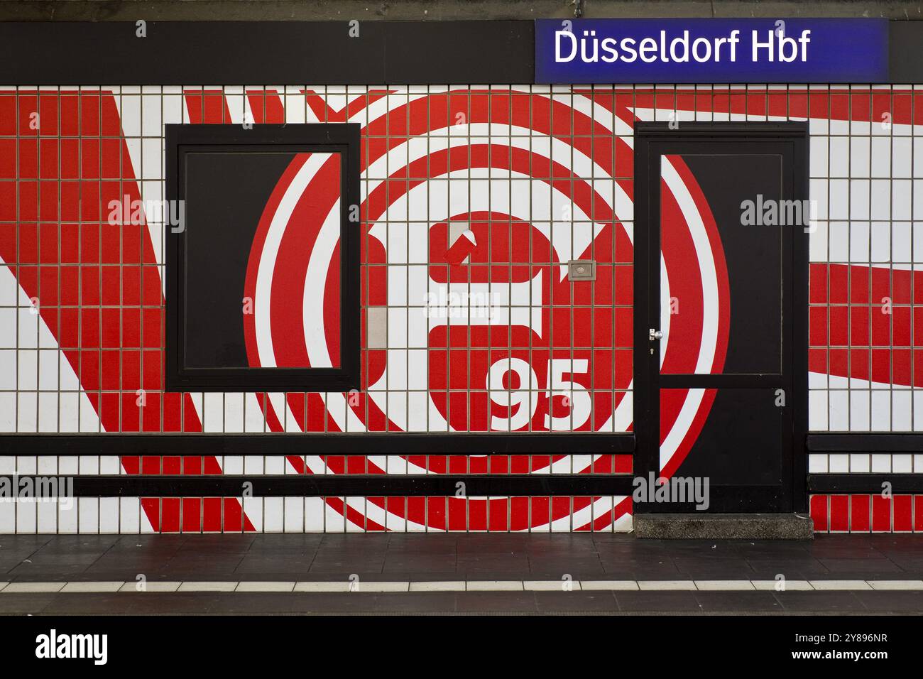 Large logo in club colours of Fortuna Duesseldorf on a wall with tiles ...