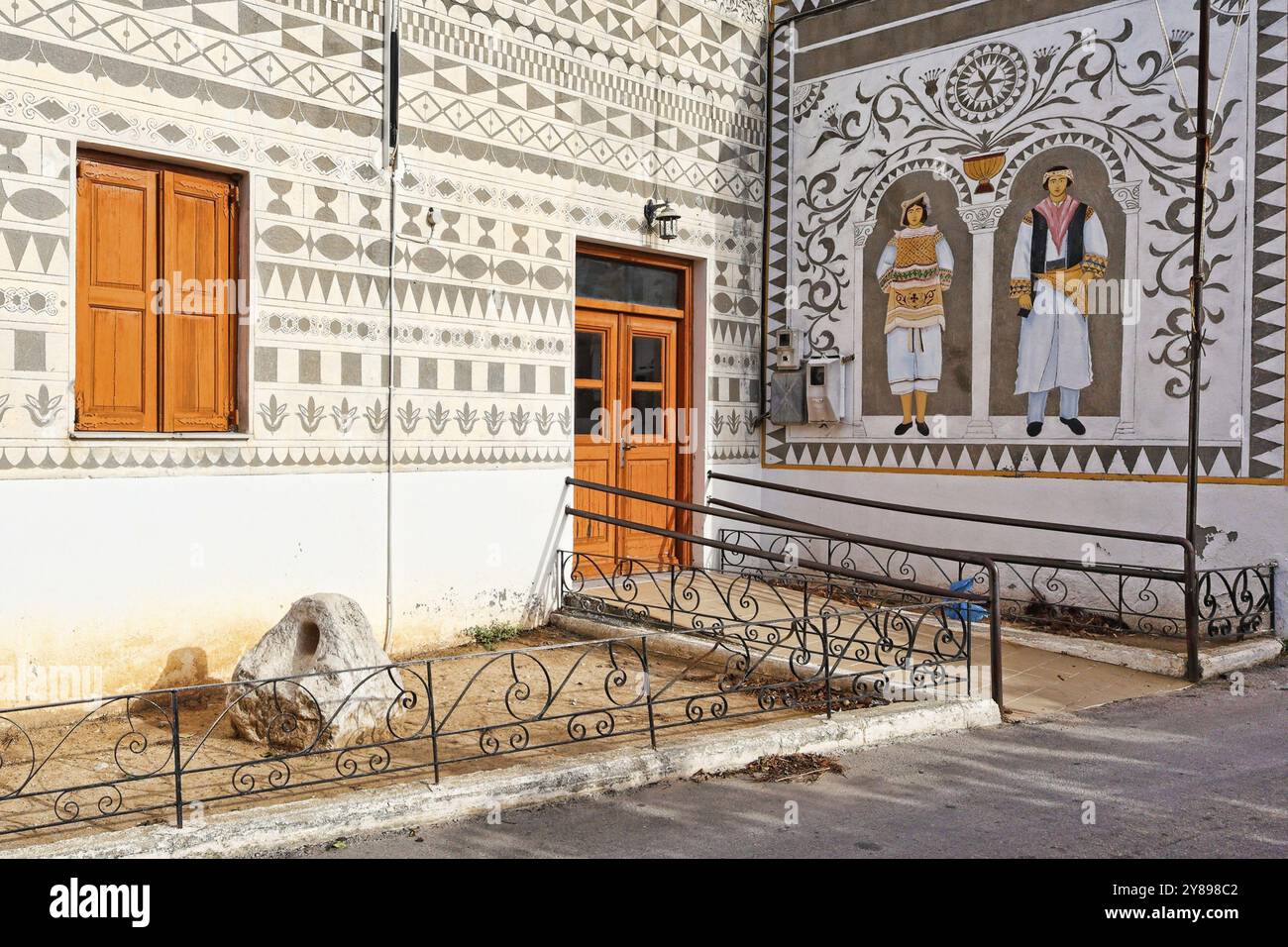 Traditional houses decorated with the famous geometric scratch patterns ...