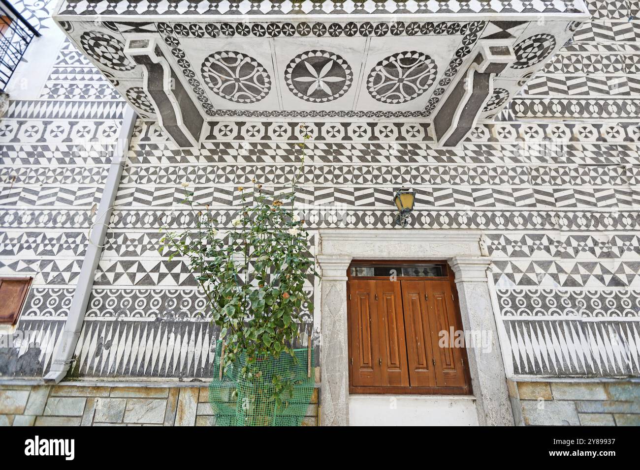 Traditional houses decorated with the famous geometric scratch patterns ...