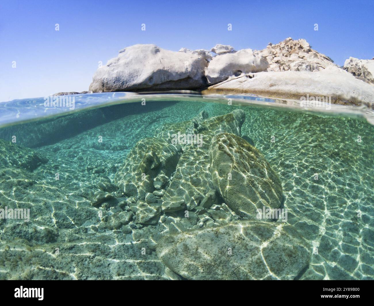 The bottom of an exotic beach on half underwater view Stock Photo - Alamy