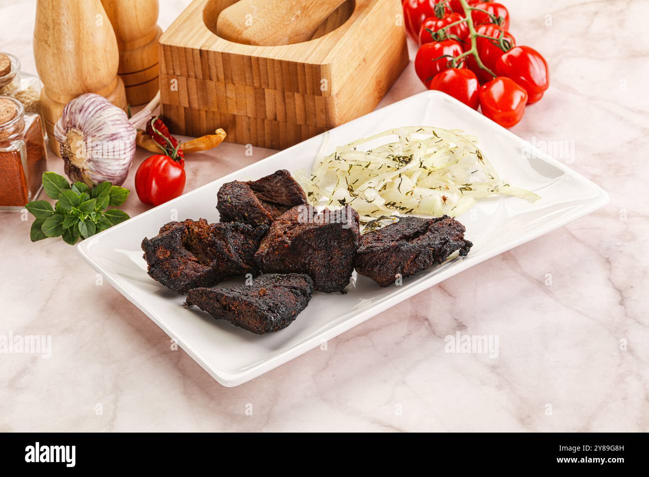 Grilled beef barbecue served onion rings Stock Photo - Alamy
