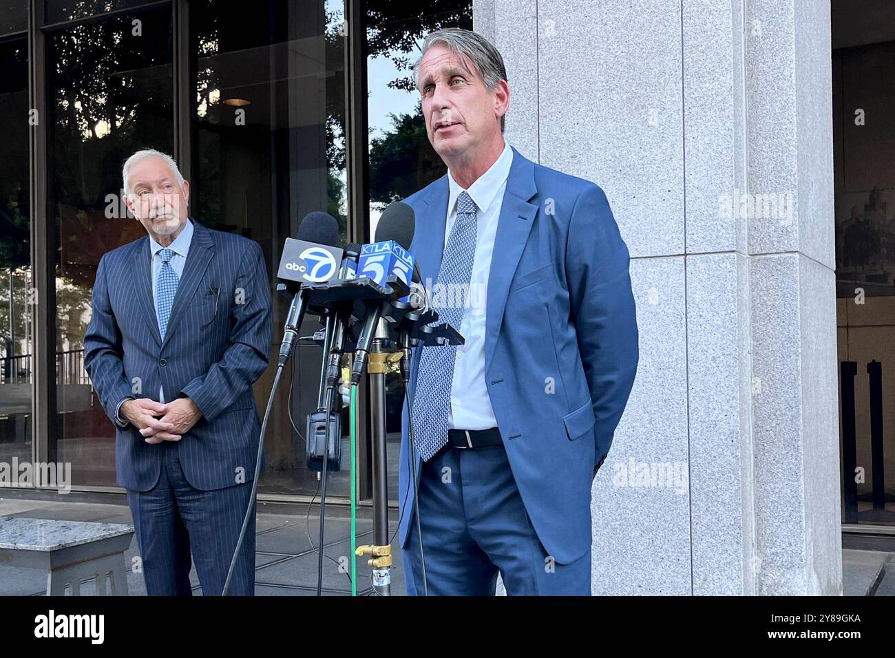 Attorneys Bryan Freedman, center, and Mark Geragos, left, address the ...