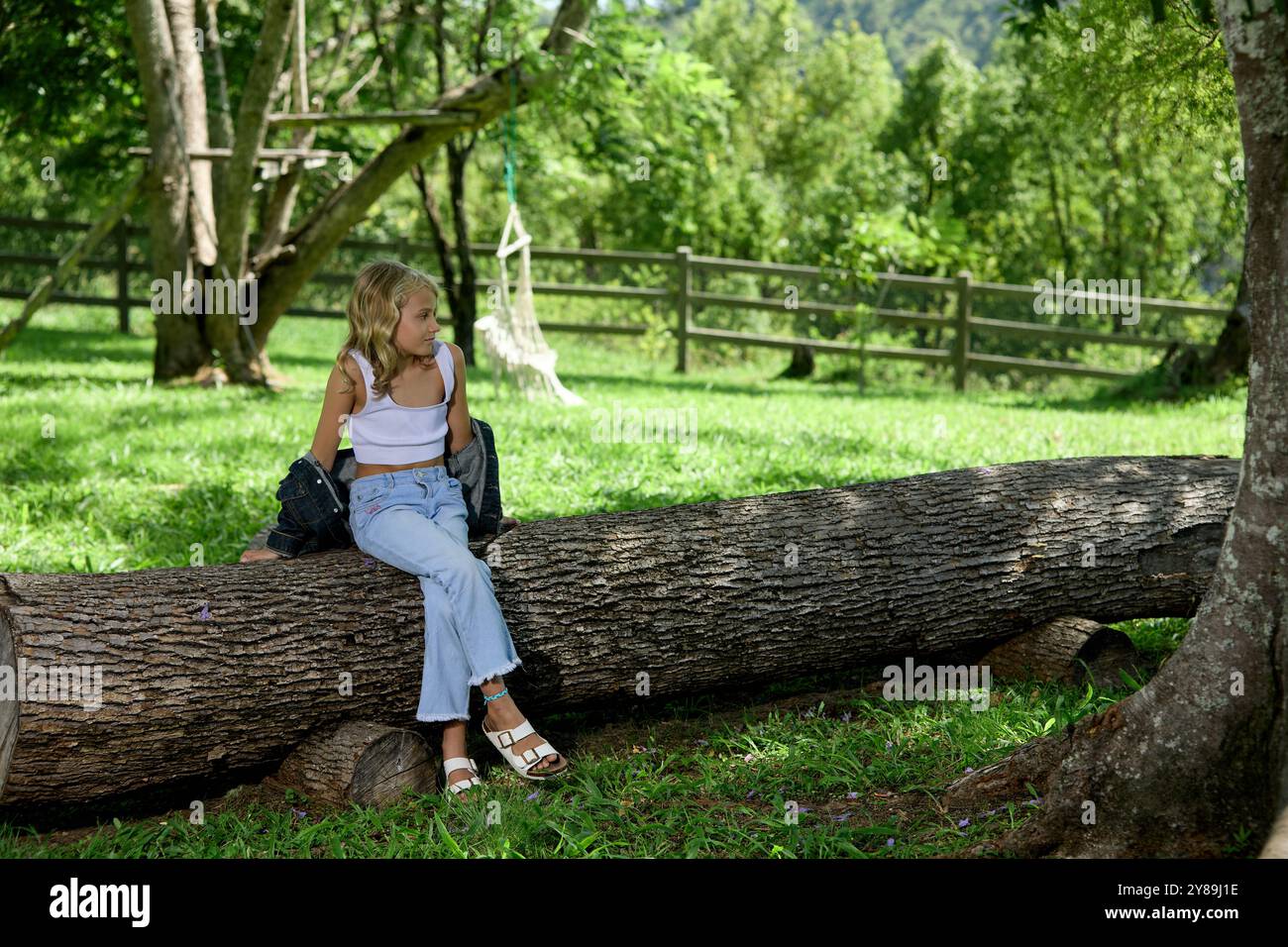 Girl sit on log hi-res stock photography and images - Alamy