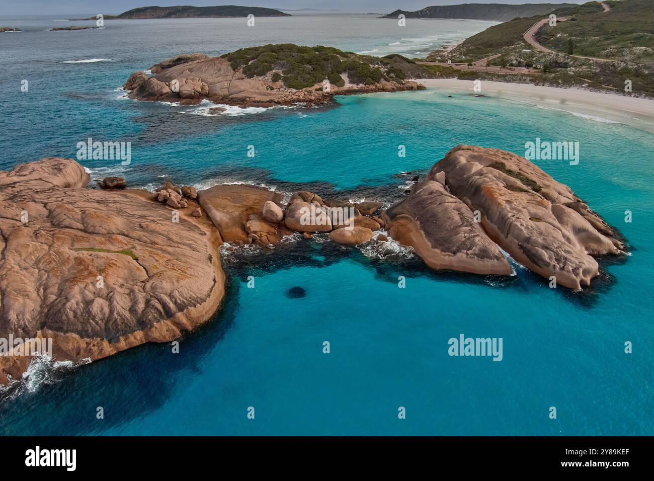 twilight bay beach with rocky islands in a turquoise sea Stock Photo ...