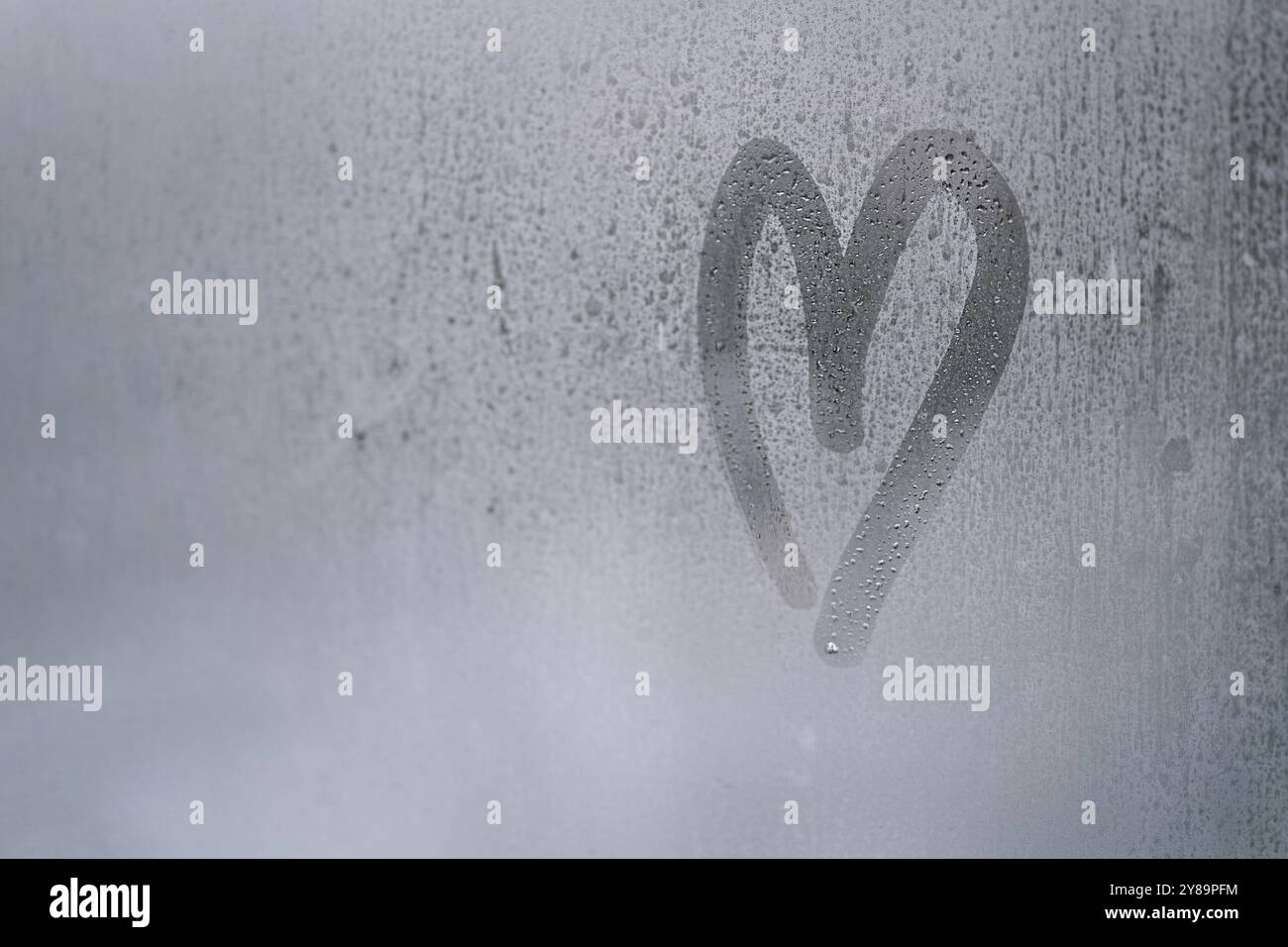 Heart shape drawn on a foggy window Stock Photo - Alamy