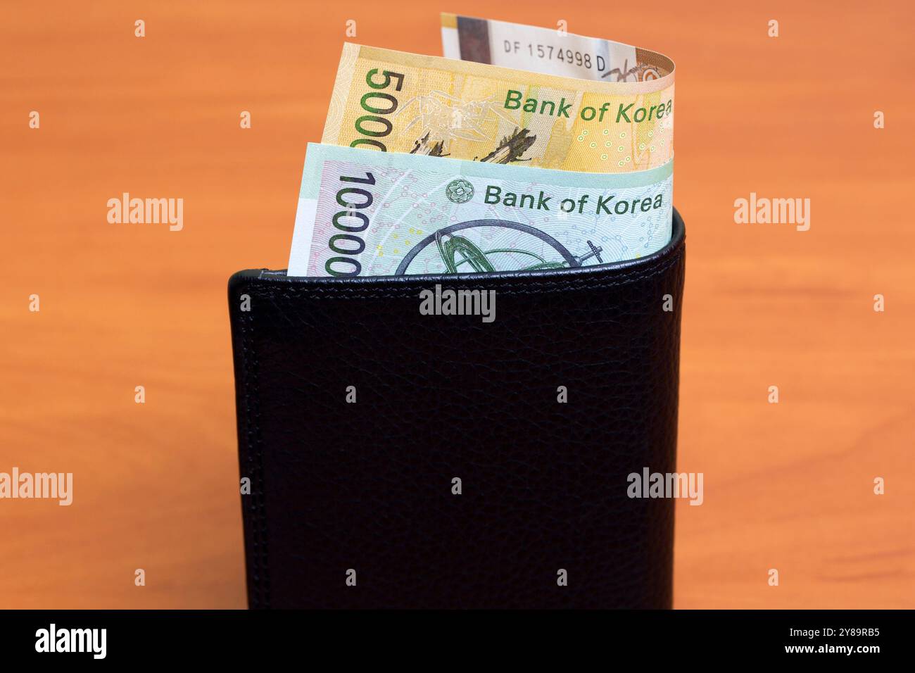 South Korean money - won in the black wallet Stock Photo - Alamy