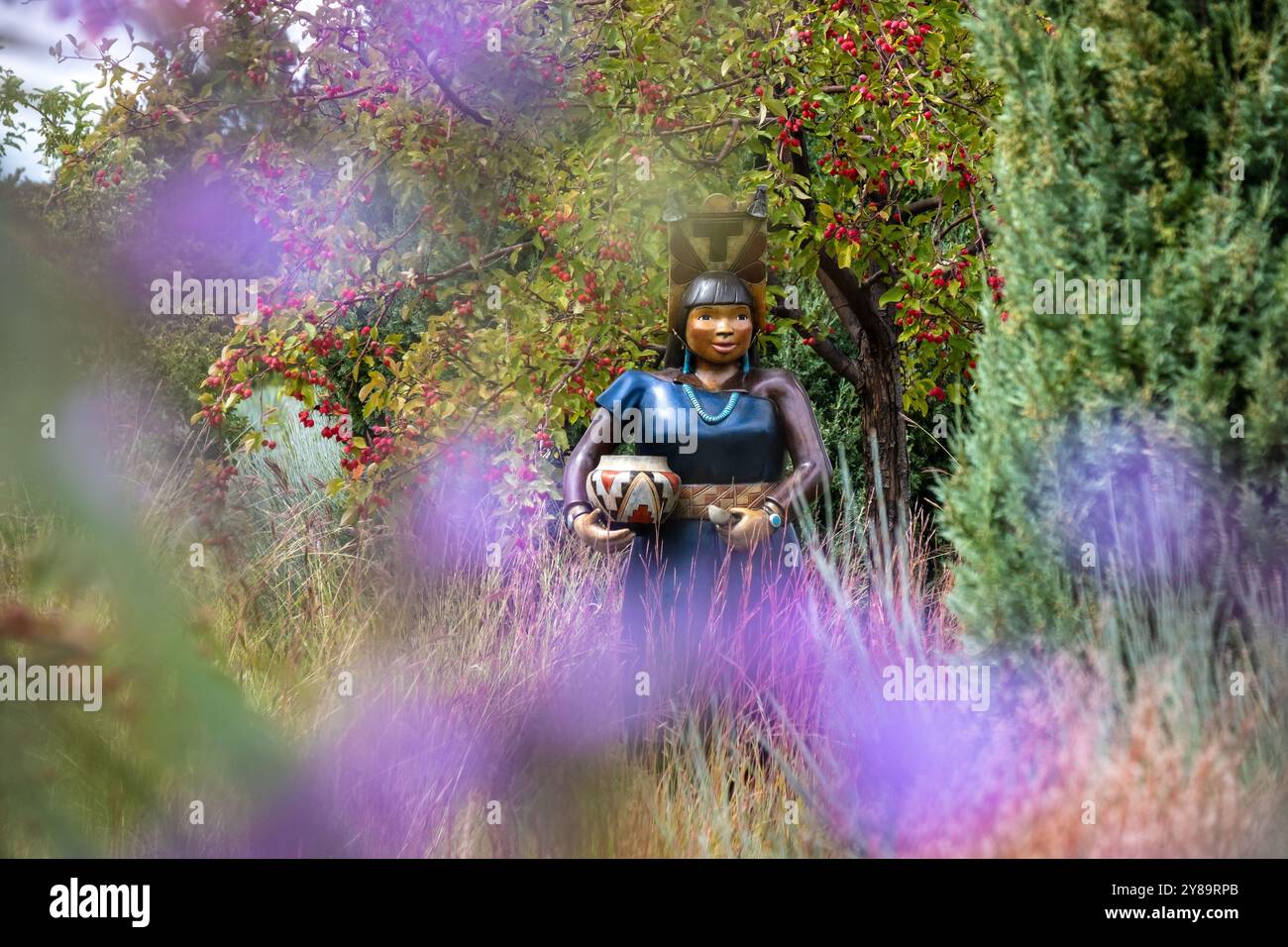 A statue of a Native American woman at the Santa Fe Botanical Garden ...