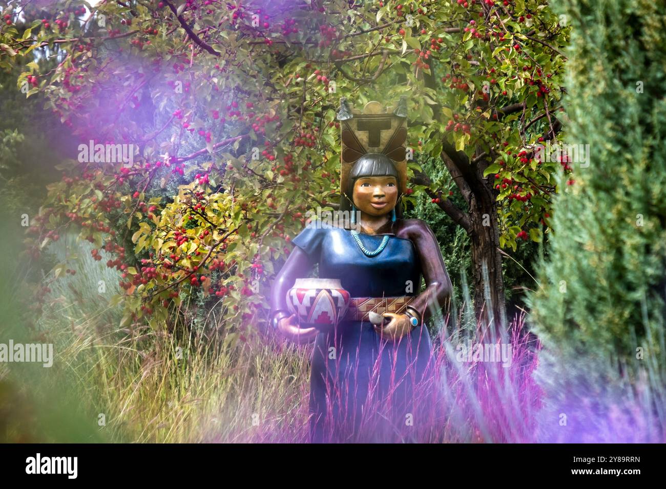 A statue of a Native American woman at the Santa Fe Botanical Garden ...