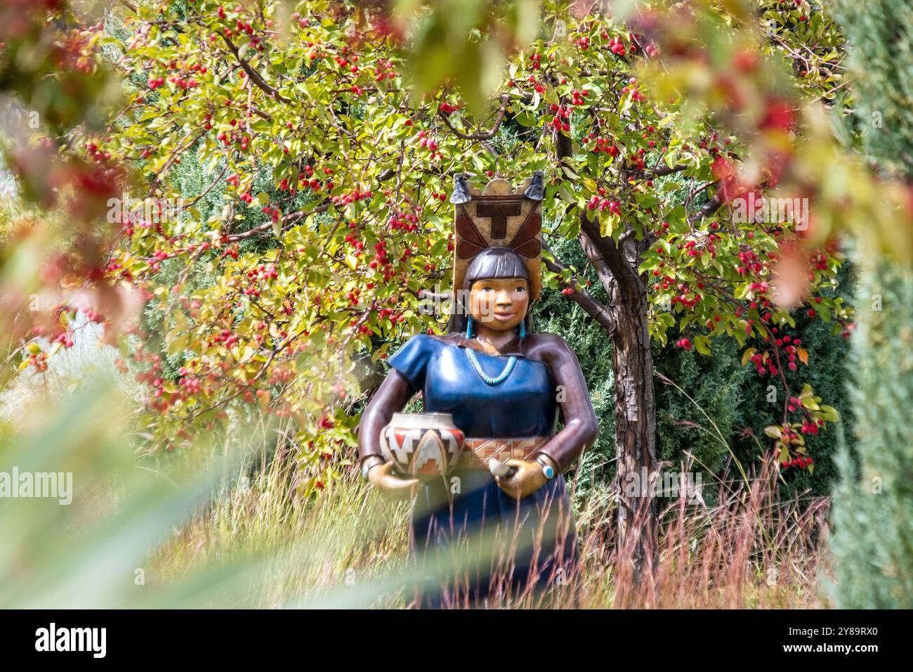A statue of a Native American woman at the Santa Fe Botanical Garden ...