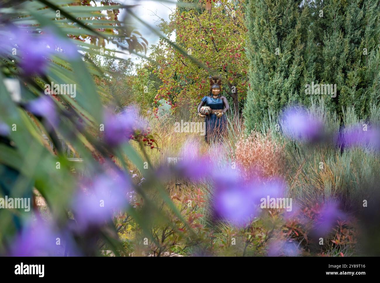 A statue of a Native American woman at the Santa Fe Botanical Garden ...